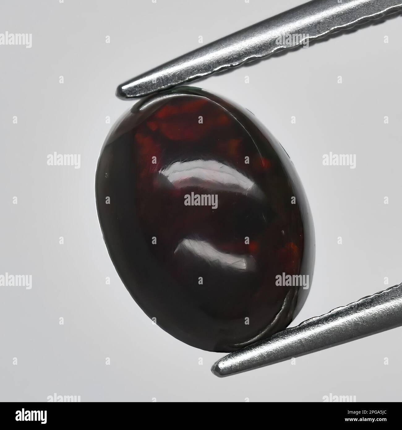 Natural precious stone opal on a black background Stock Photo - Alamy