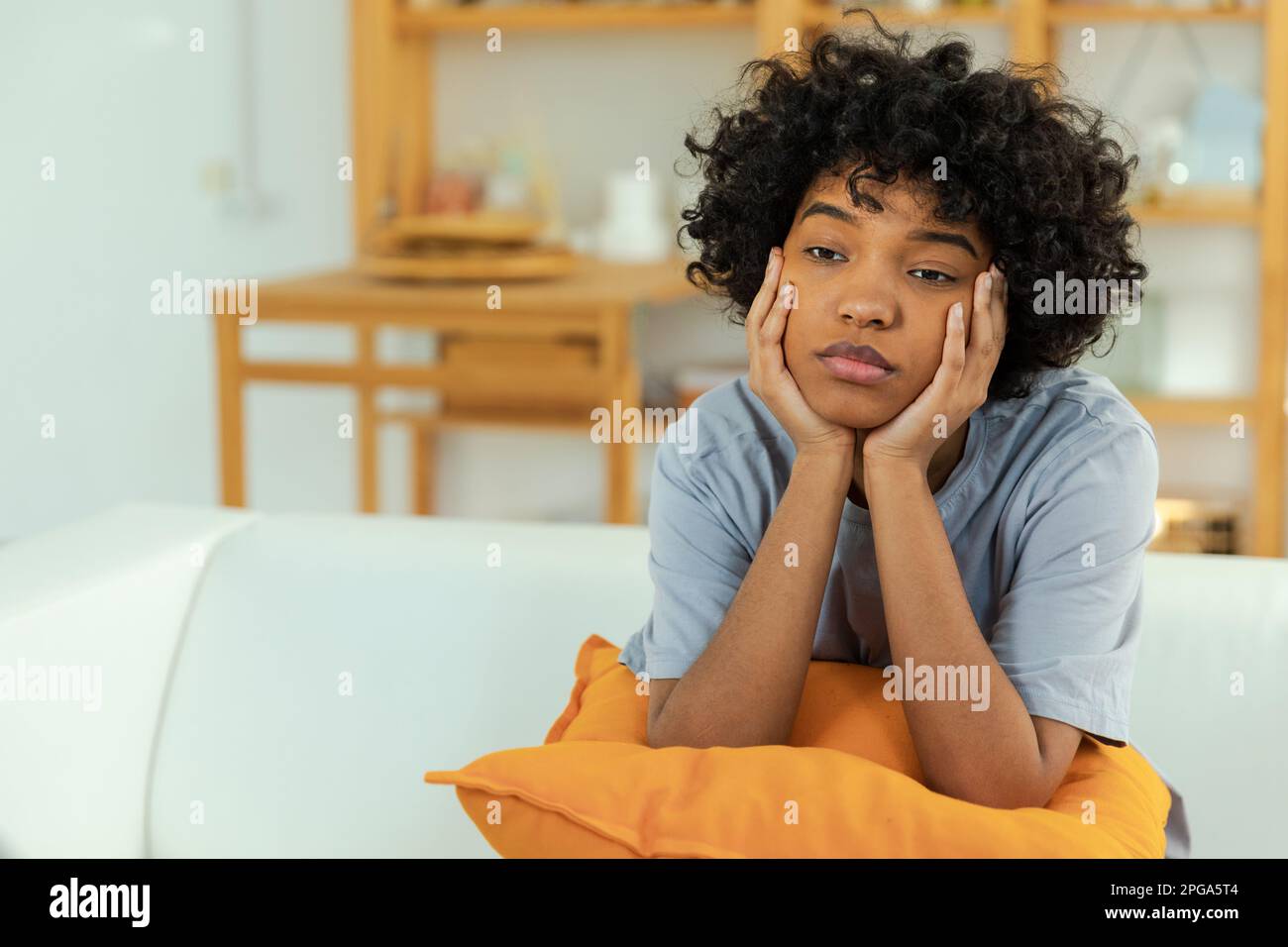 African american sad thoughtful girl at home. Young african woman feels ...