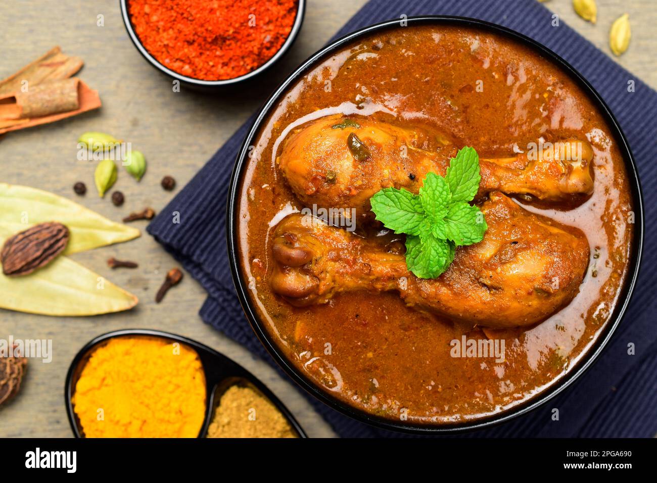 Indian chicken curry leg piece with traditional whole spices Stock ...