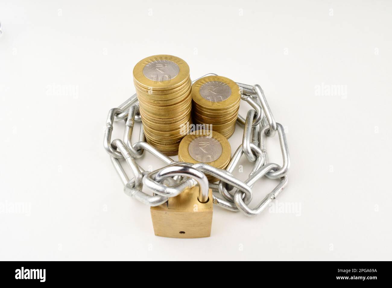 Indian currency coin with lock isolated on white background, money ...