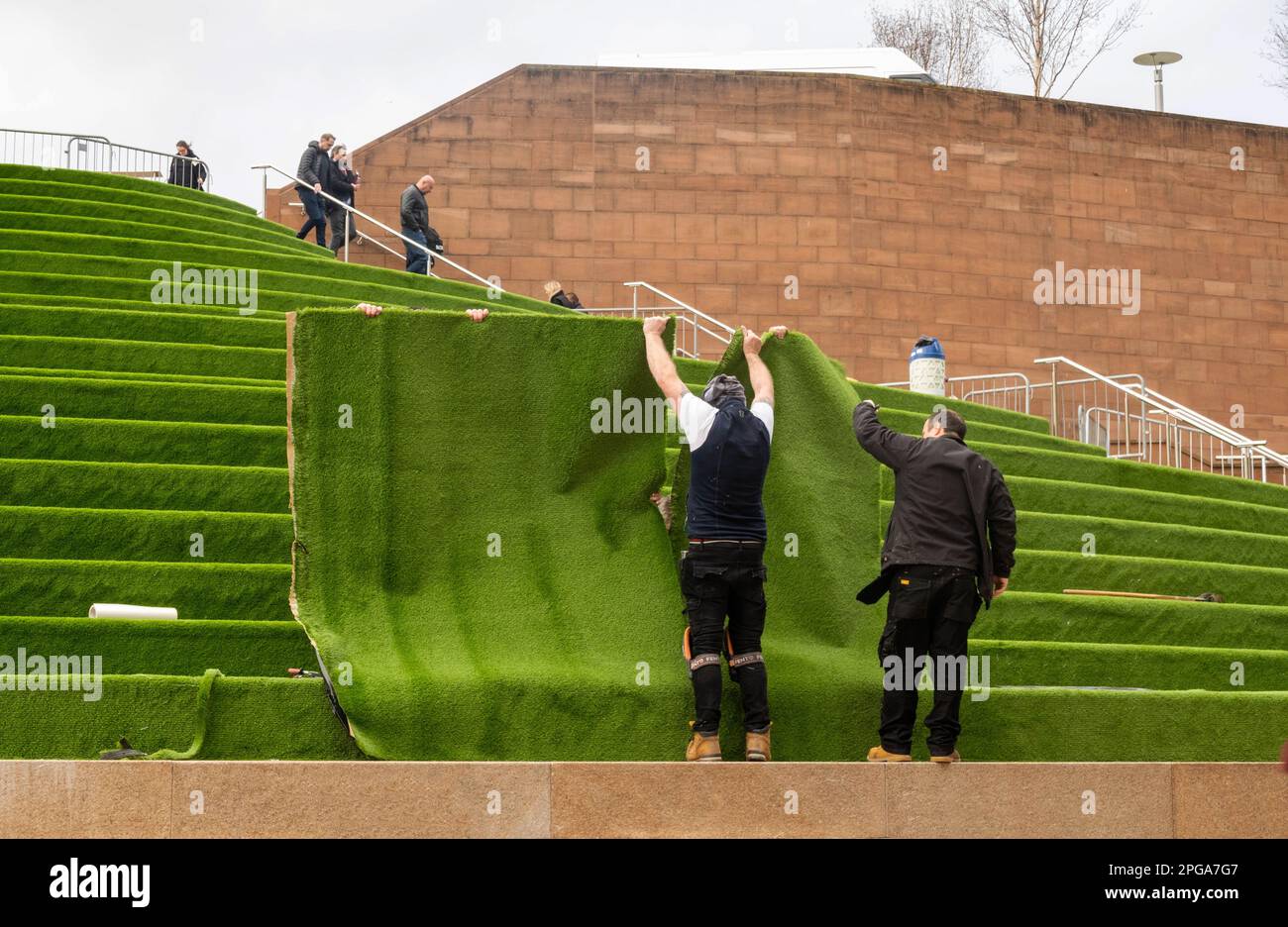 Imitation grass carpet being replaced on steps to Level Three of ...