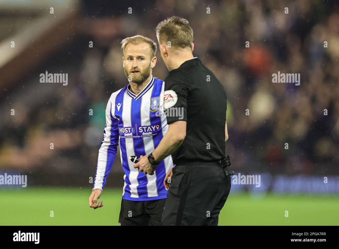 Barry Bannan #10 of Sheffield Wednesday and referee Ross Joyce chat ...