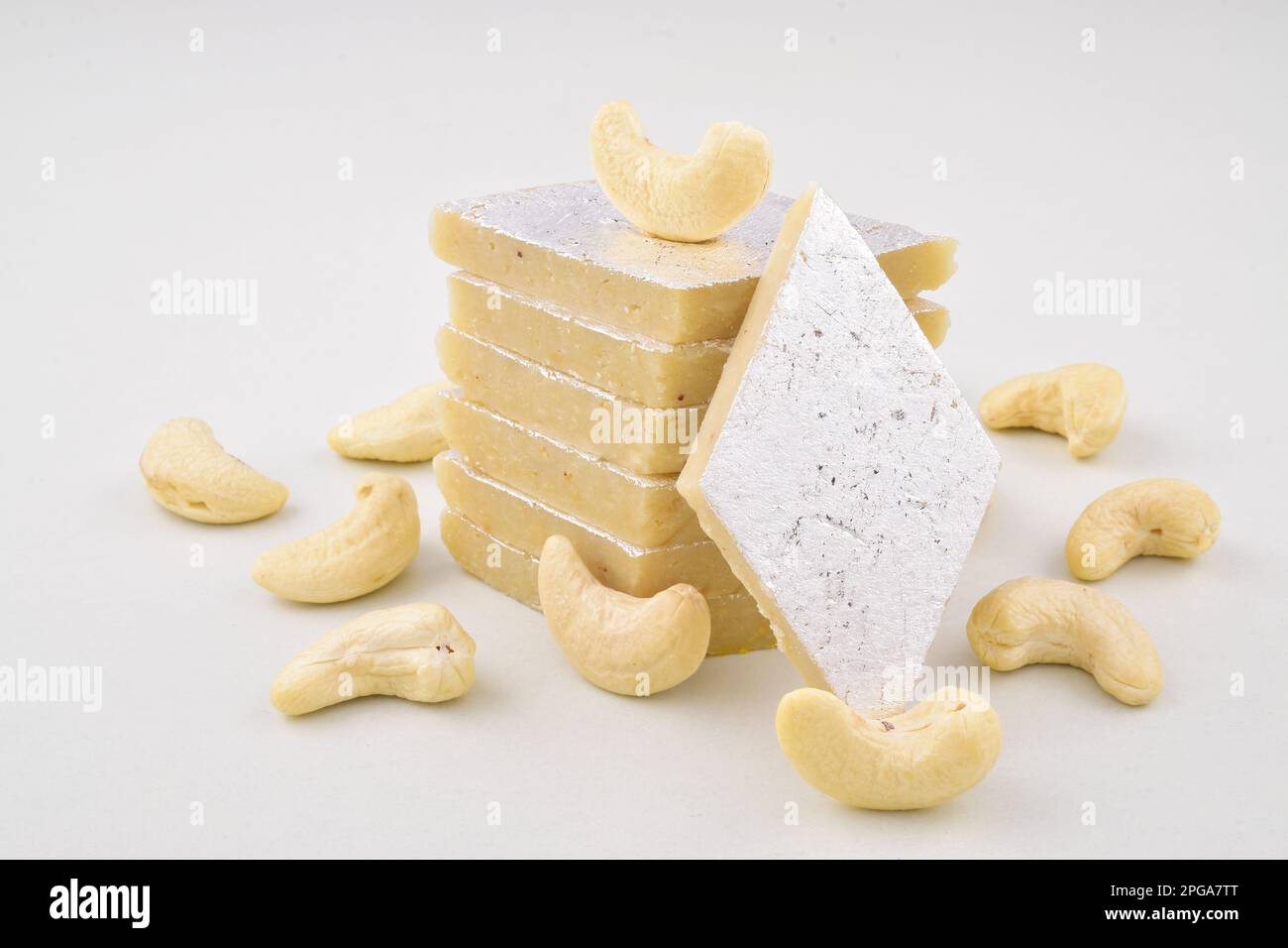 Kaju katli sweet on white background with cashew Stock Photo - Alamy