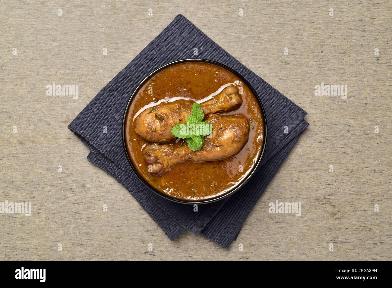 Top view of spicy chicken curry in bowl, indian style non veg food ...