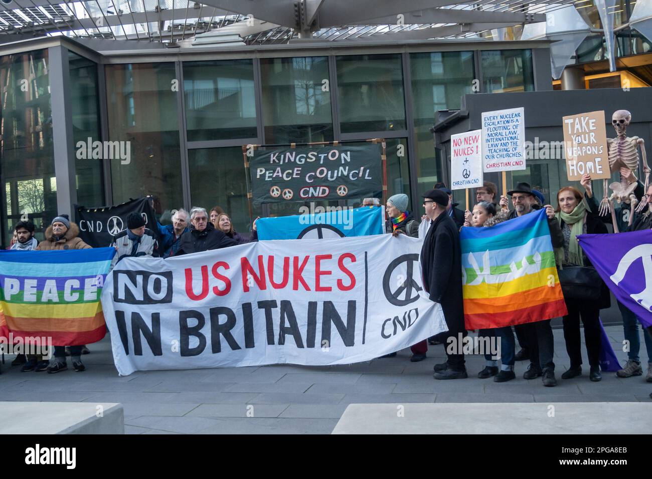 London, UK. 21 Mar 2023. Protesters with banners, placards and a ...