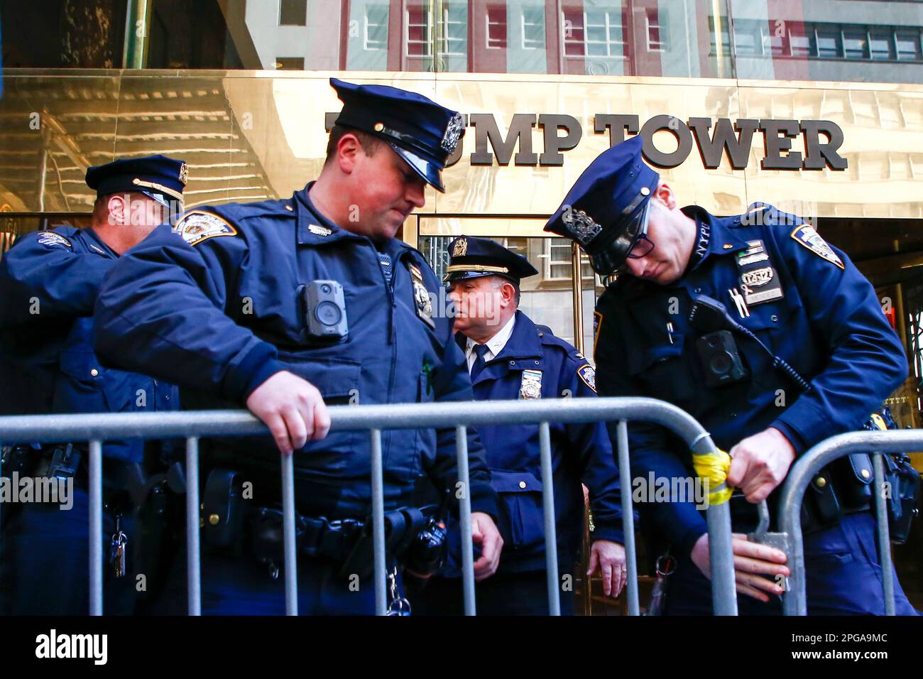 New York, New York, USA. 21st Mar, 2023. NYPD officers set up step ...