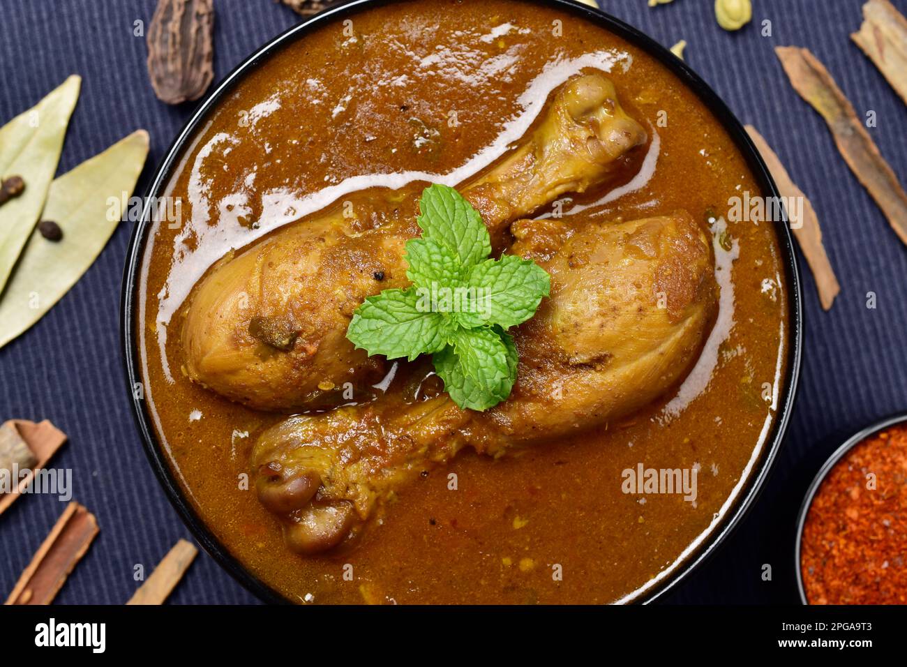 Indian style spicy chicken curry top view Stock Photo - Alamy