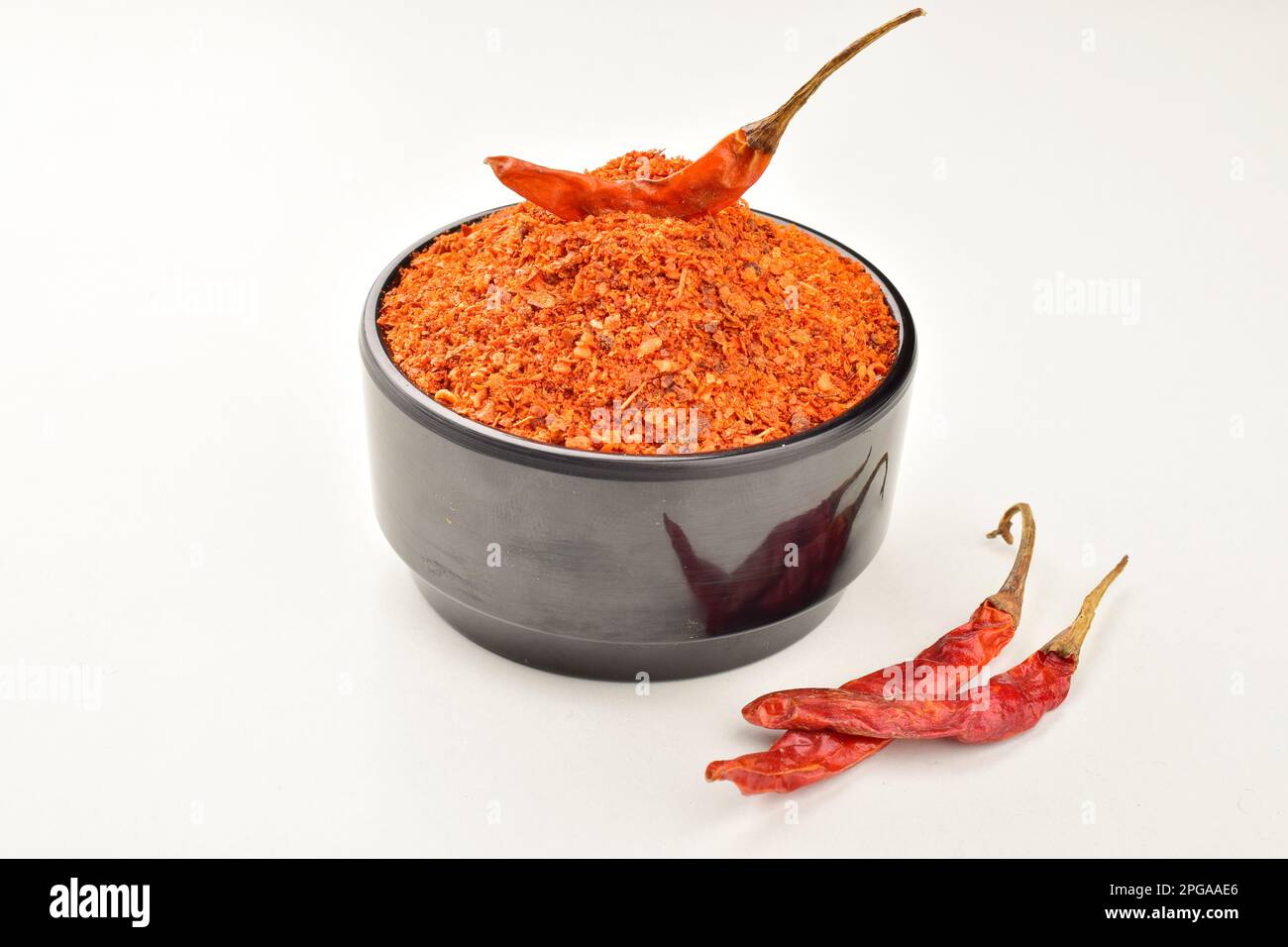 Red chilli powder isolated on white background Stock Photo - Alamy