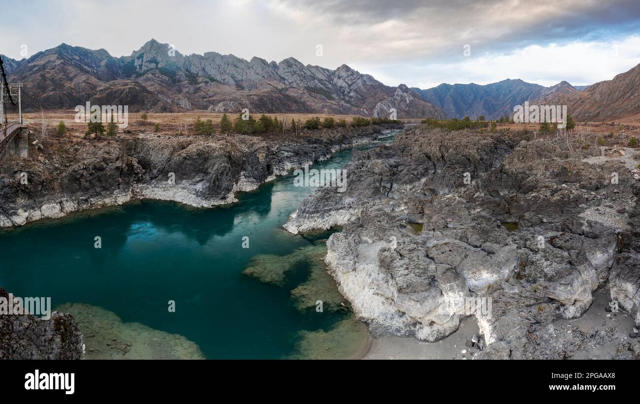 Panorama rocky shores made of black stone of volcanic rock in a narrow ...