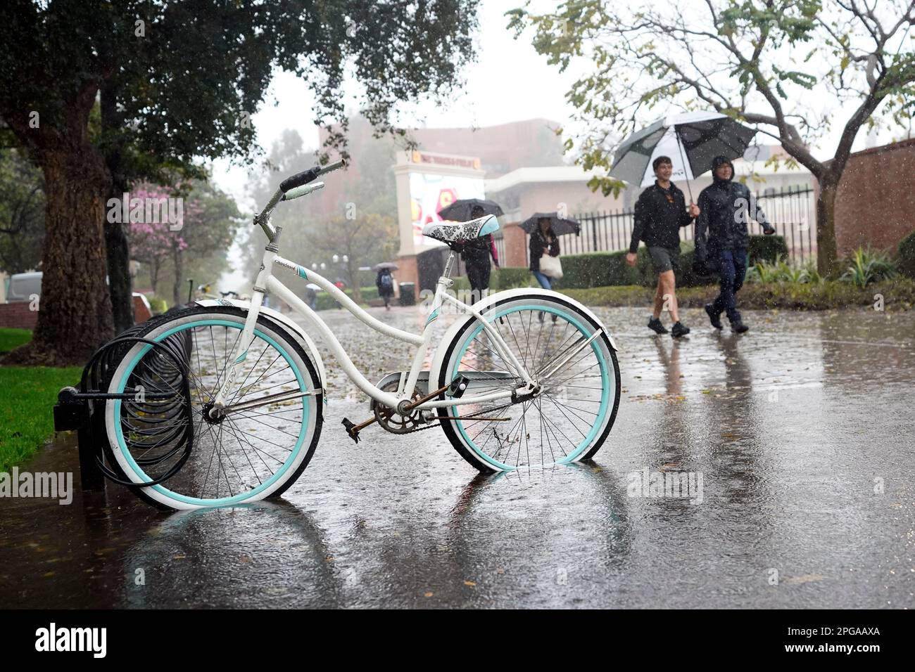 Rain falls on pedestrians on the University of Southern California ...