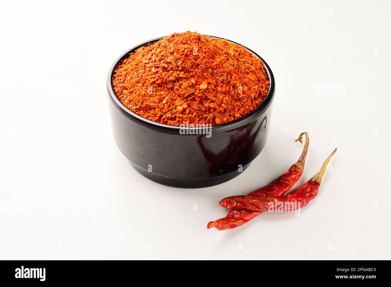 Closeup of ground red chilli isolated on white background Stock Photo ...