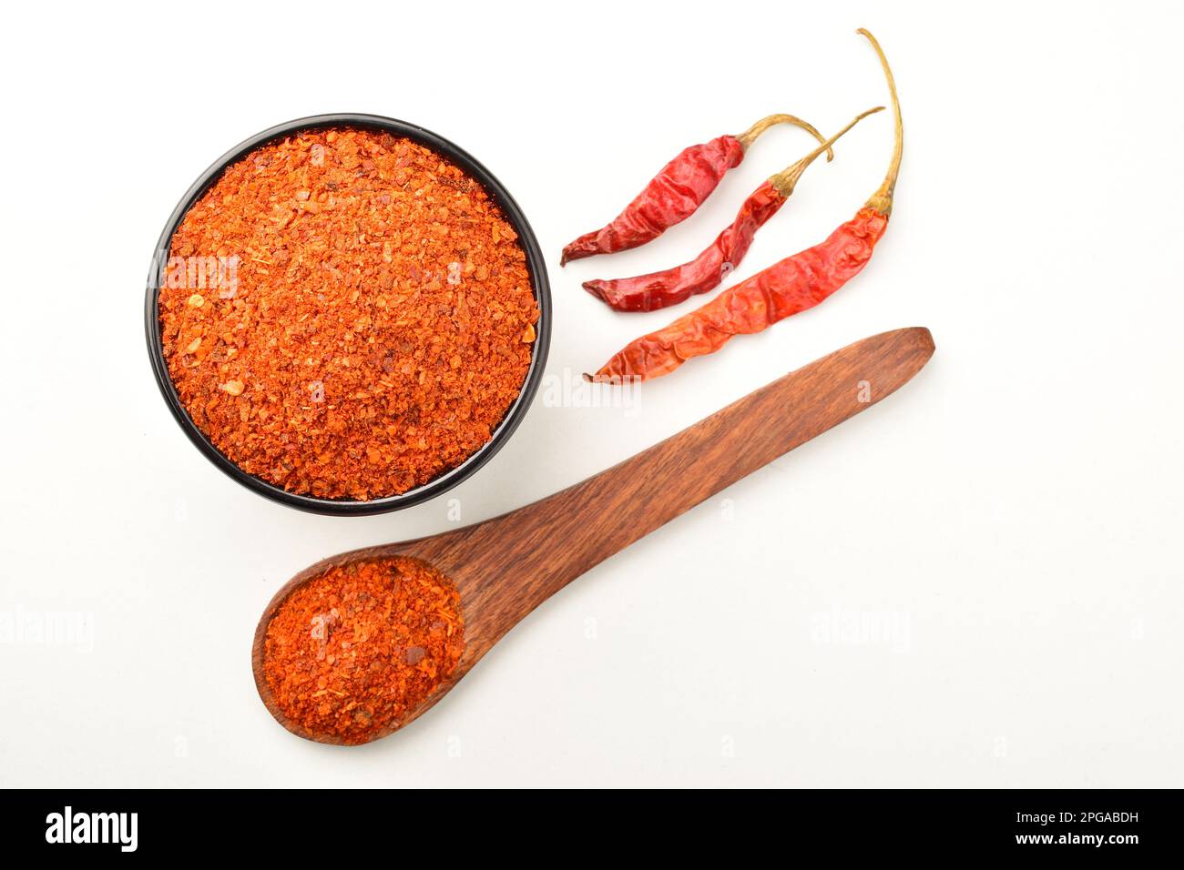 Top view of red chilli powder with dry cayenne isolated on white ...