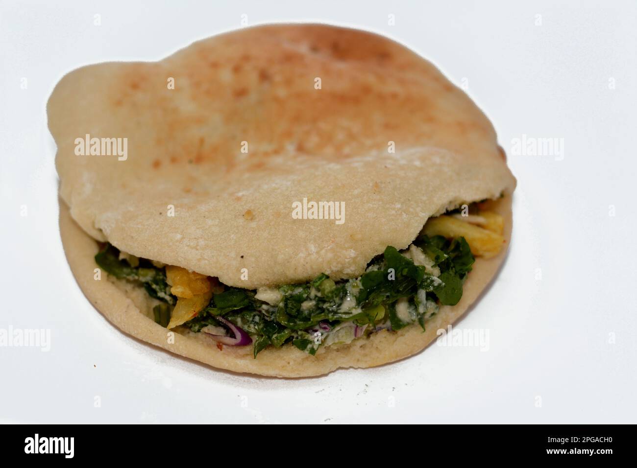 Flat Shami Syrian bread filled with french fries and green salad ...