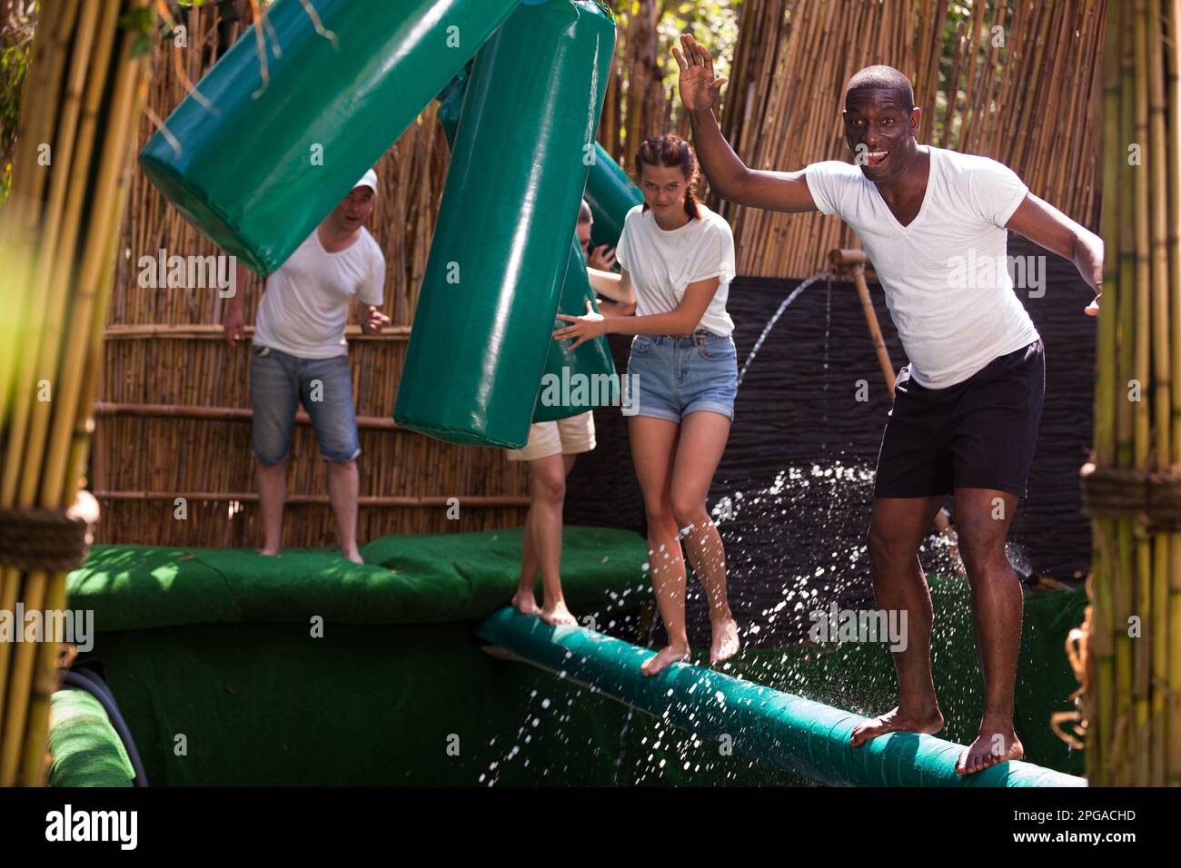 Obstacle course over the water - fun adventure in an amusement park ...