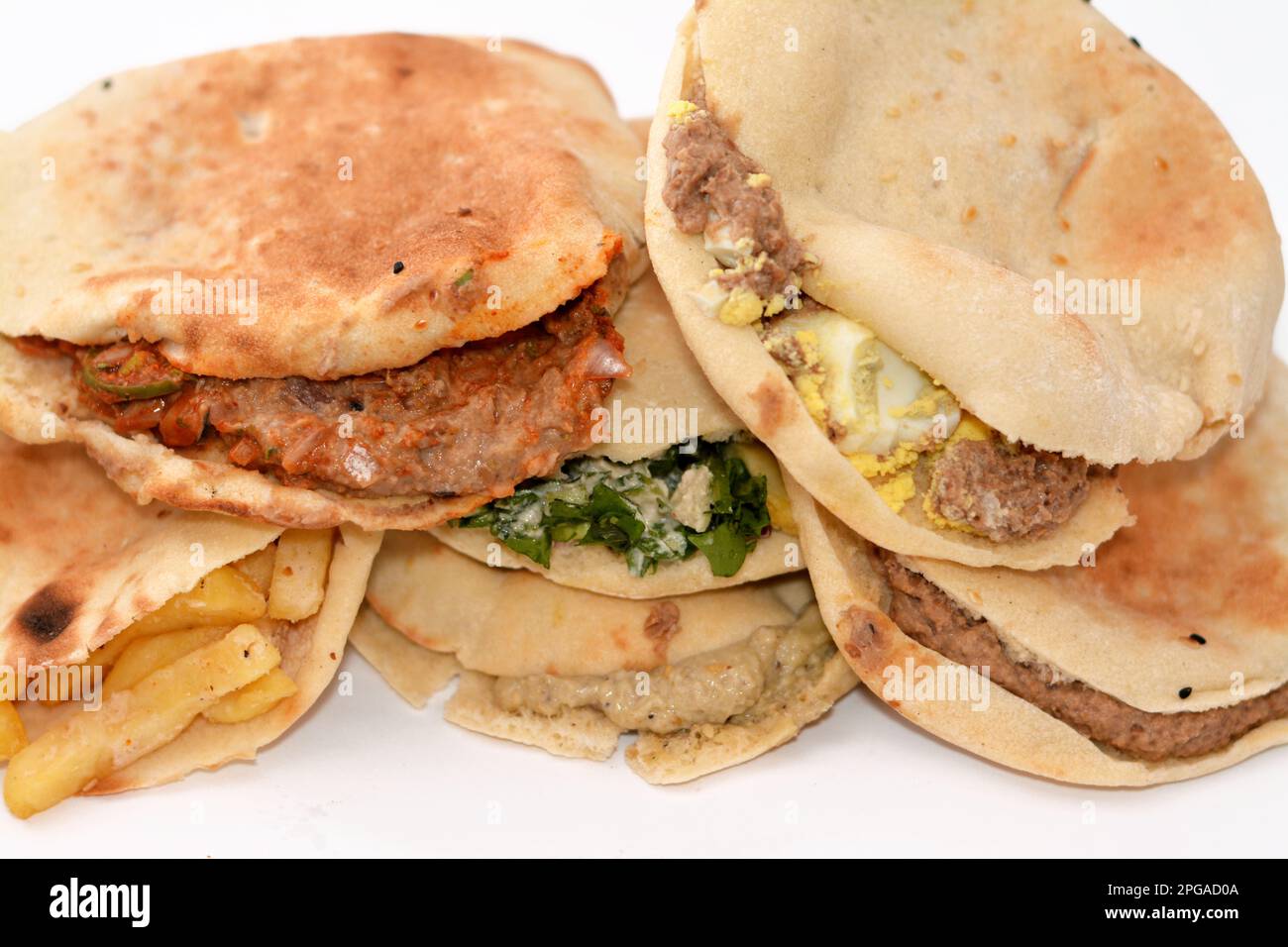 Traditional Egyptian breakfast street sandwiches of mashed fava beans ...