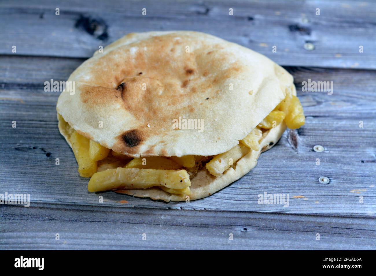 Potatoes with Tahini in Flat Shami Syrian bread filled with french ...