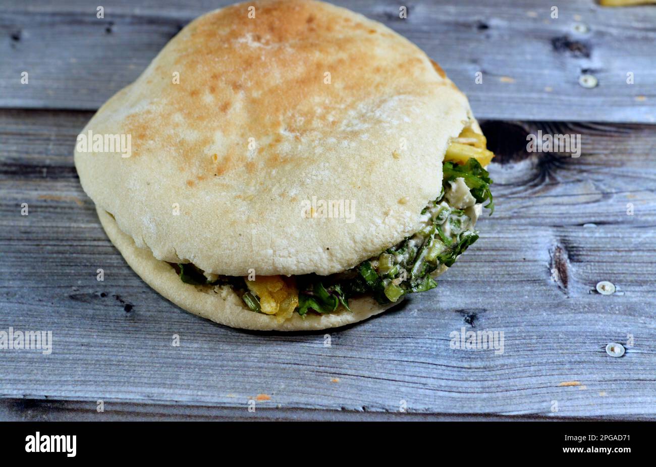 Flat Shami Syrian bread filled with french fries and green salad ...