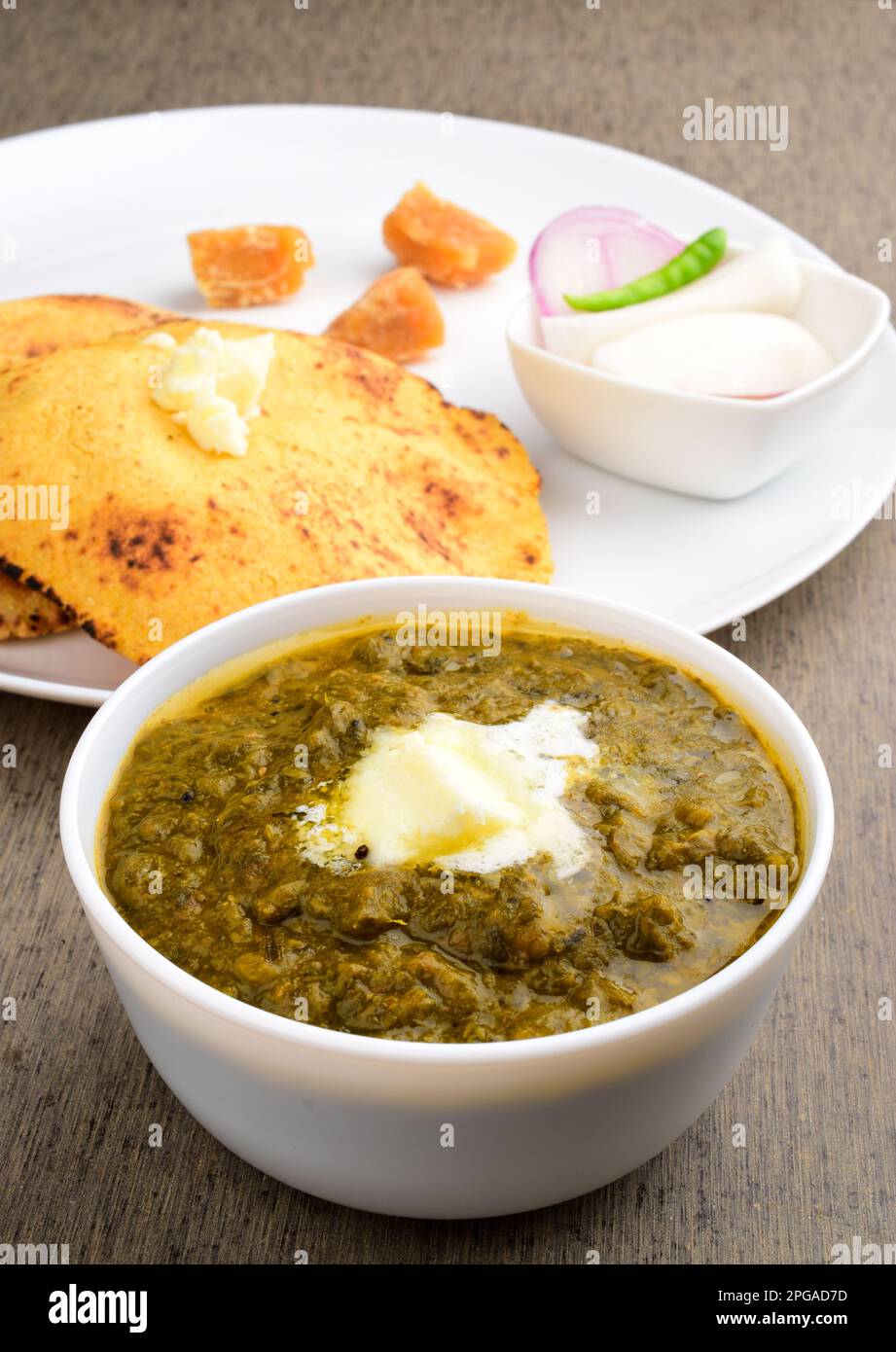 Healthy saag bowl with roti and salad at table Stock Photo - Alamy