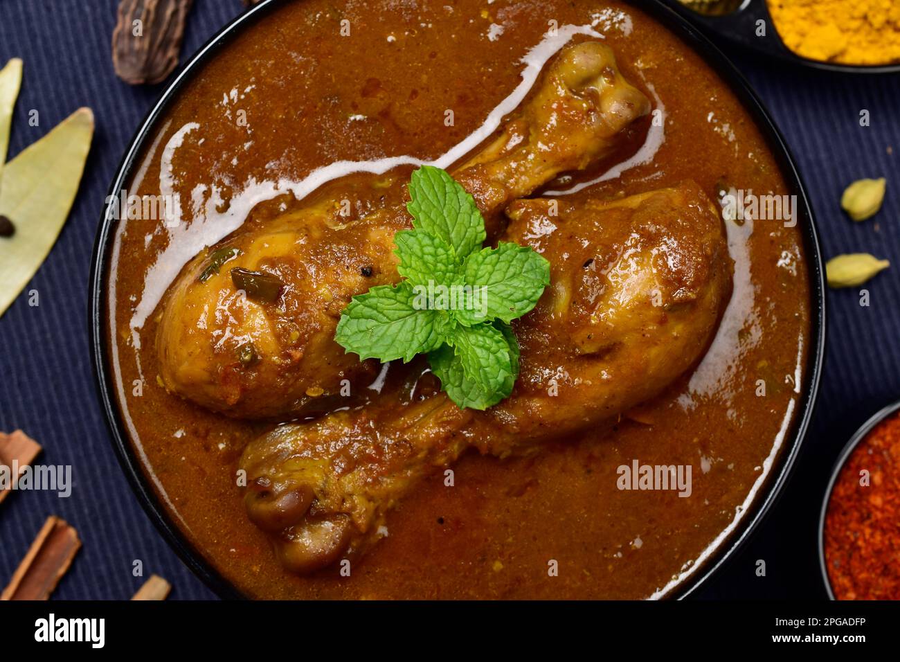 Spicy chicken masala curry top view Stock Photo - Alamy