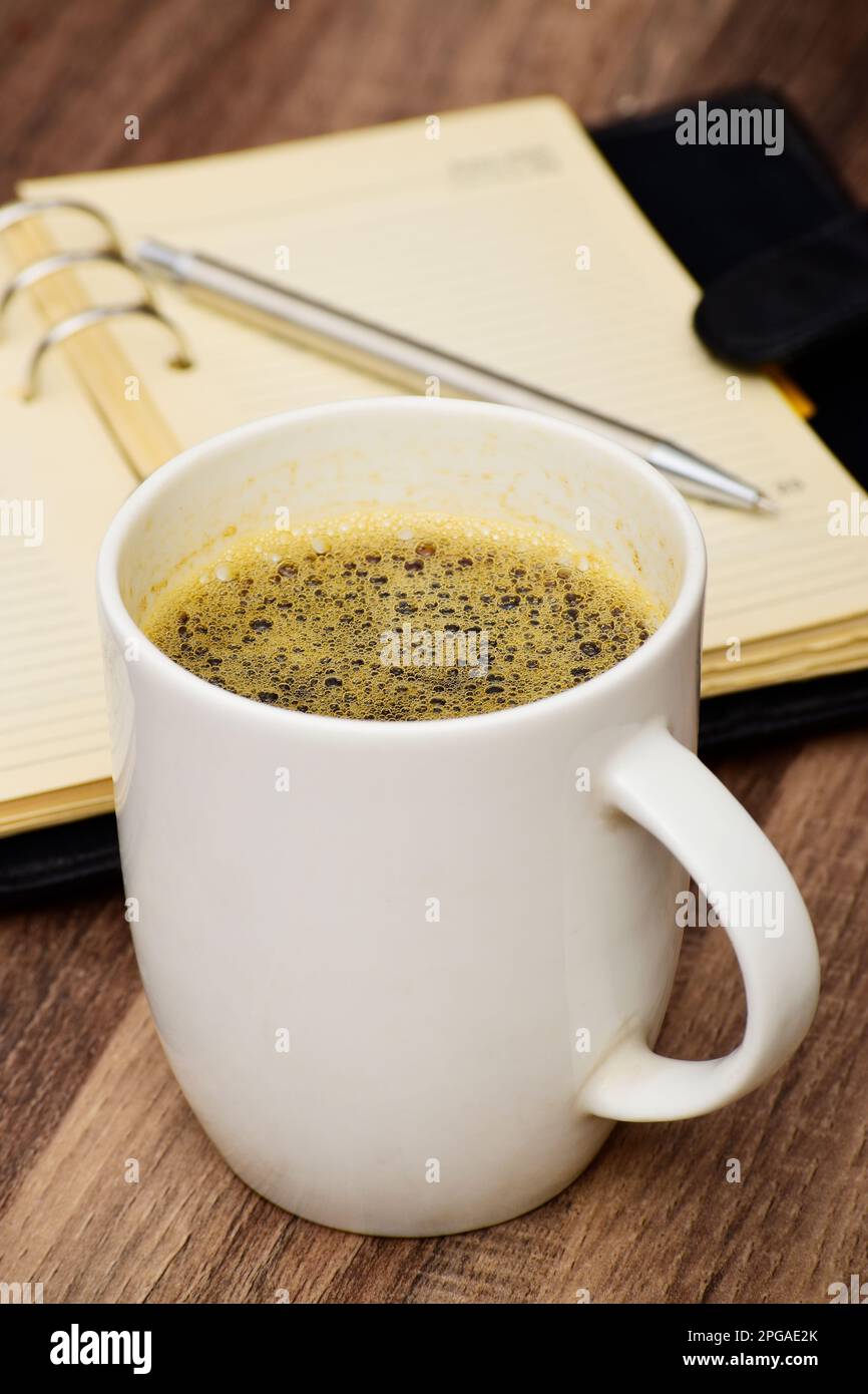 Black coffee cup at office table Stock Photo - Alamy