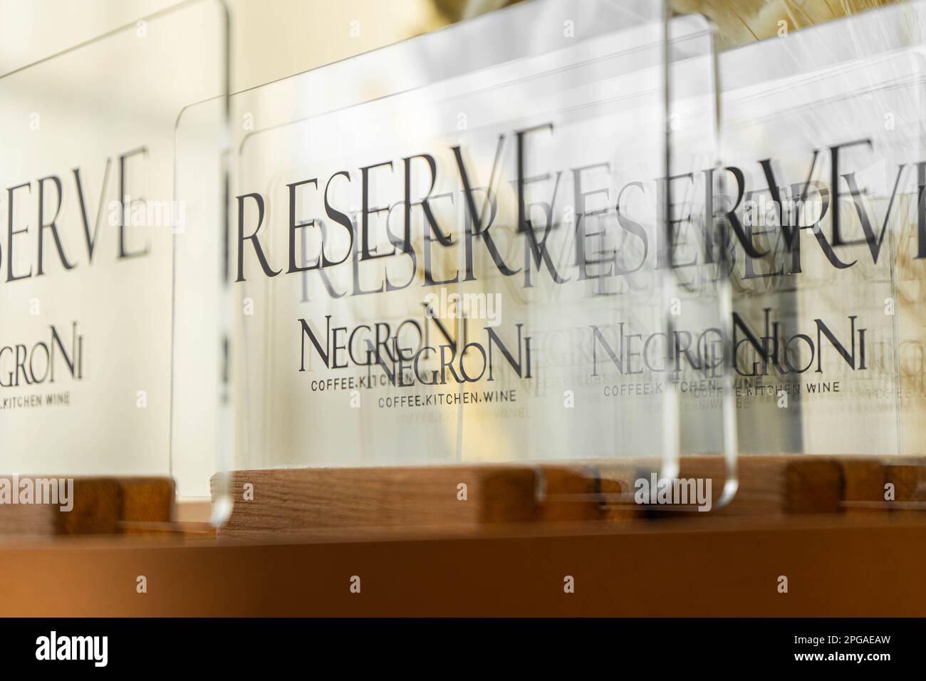 A close-up shot of a restaurant reservation stand with a bold, black ...