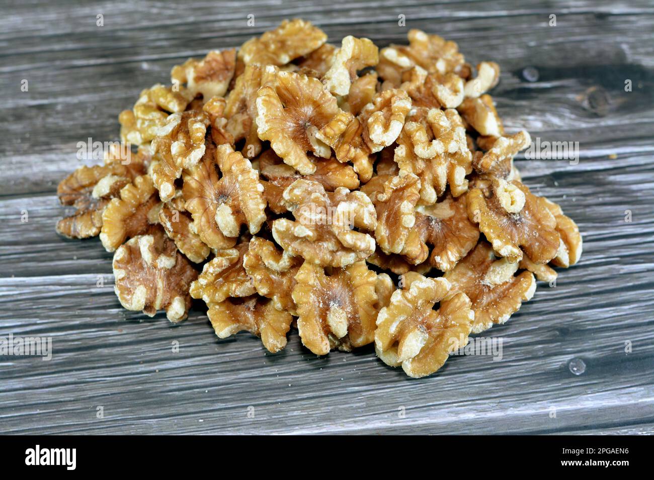 The walnut, an edible seed of any tree of the genus Juglans (family ...