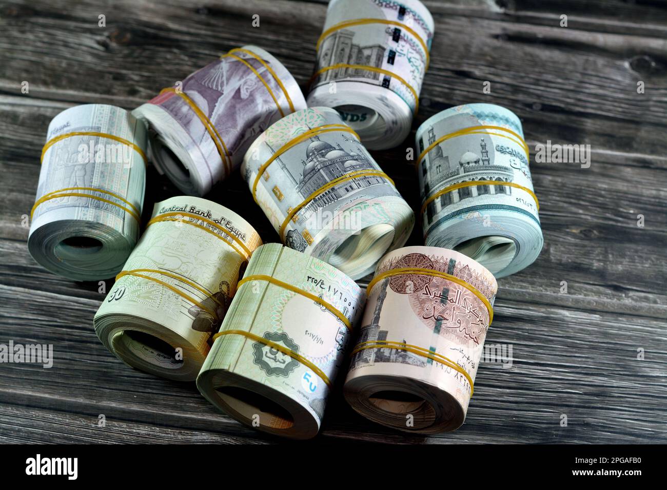 Background of bundles and rolls of Egyptian money currency cash ...