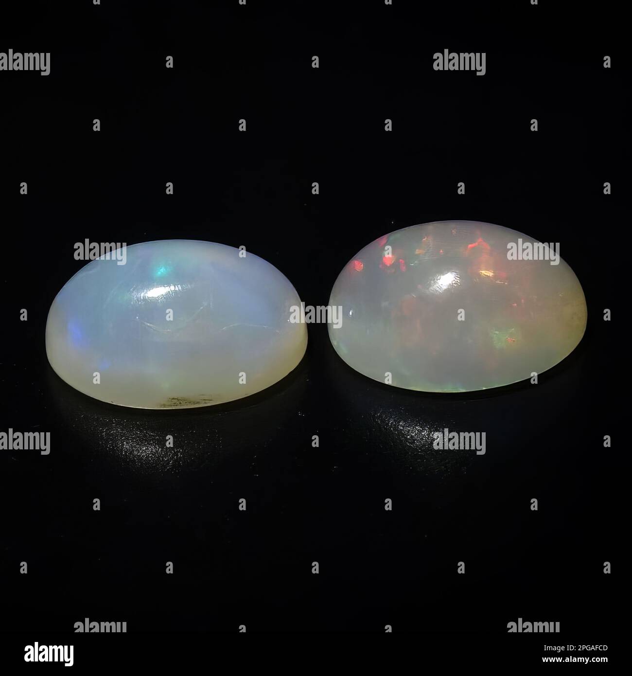 Natural precious stone opal on a black background Stock Photo - Alamy