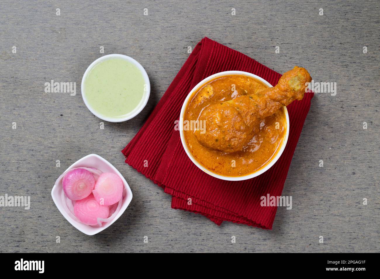 Top view of butter chicken in bowl with onion and chutney Stock Photo ...