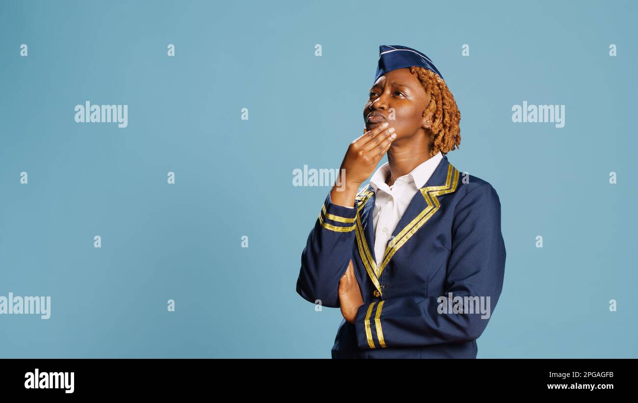 Young aircrew member thinking about new ideas, brainstorming solutions ...