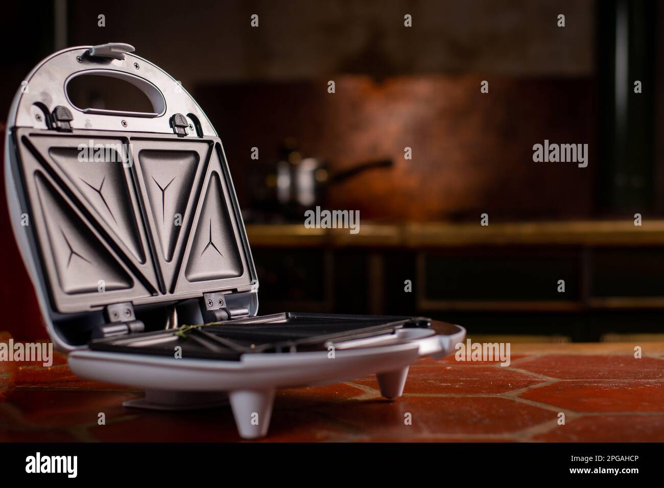 Open empty sandwich maker in the kitchen. Preparation for cooking ...