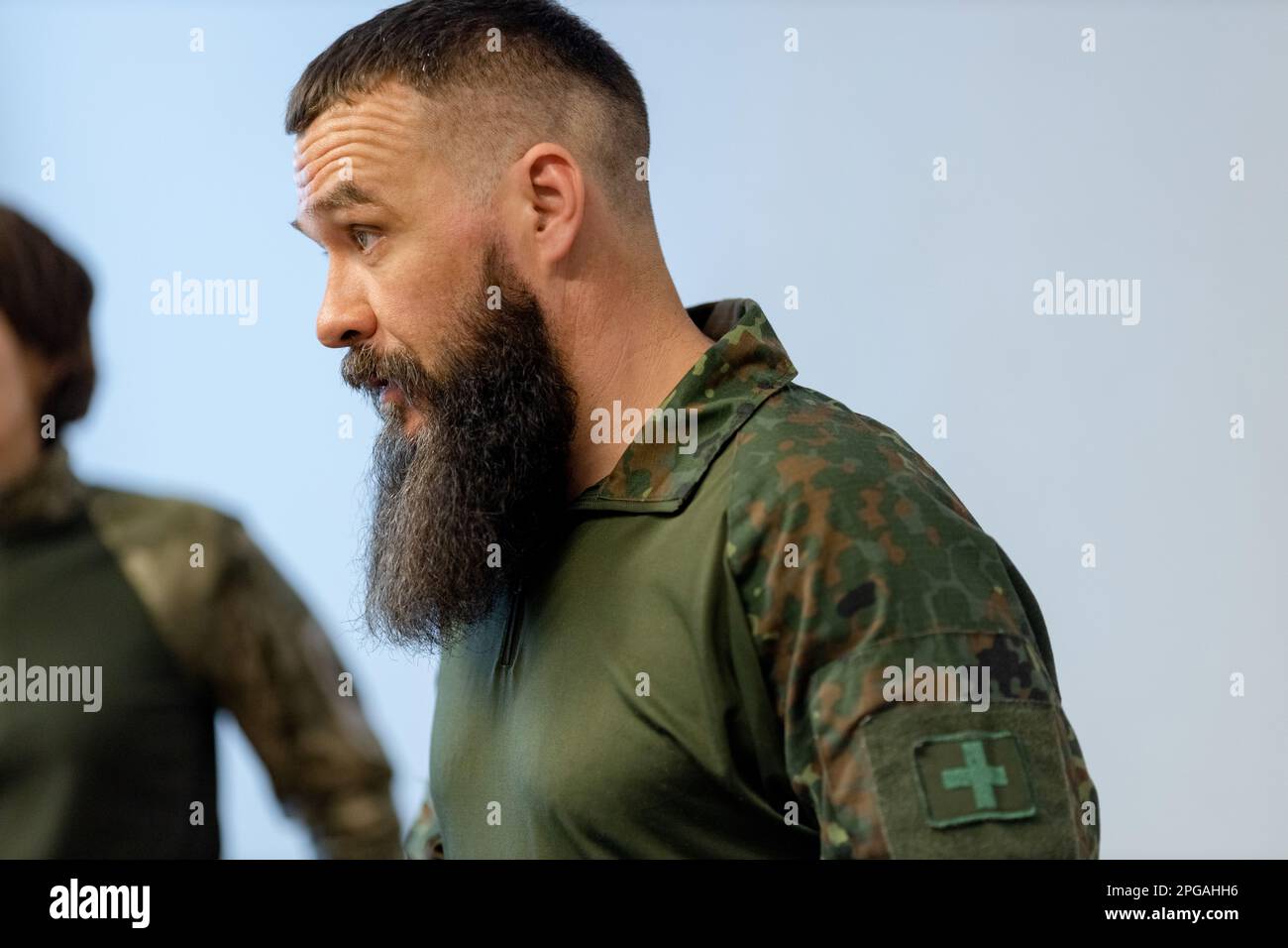 A 40-year-old bearded military medic conducts classes. Courses in ...