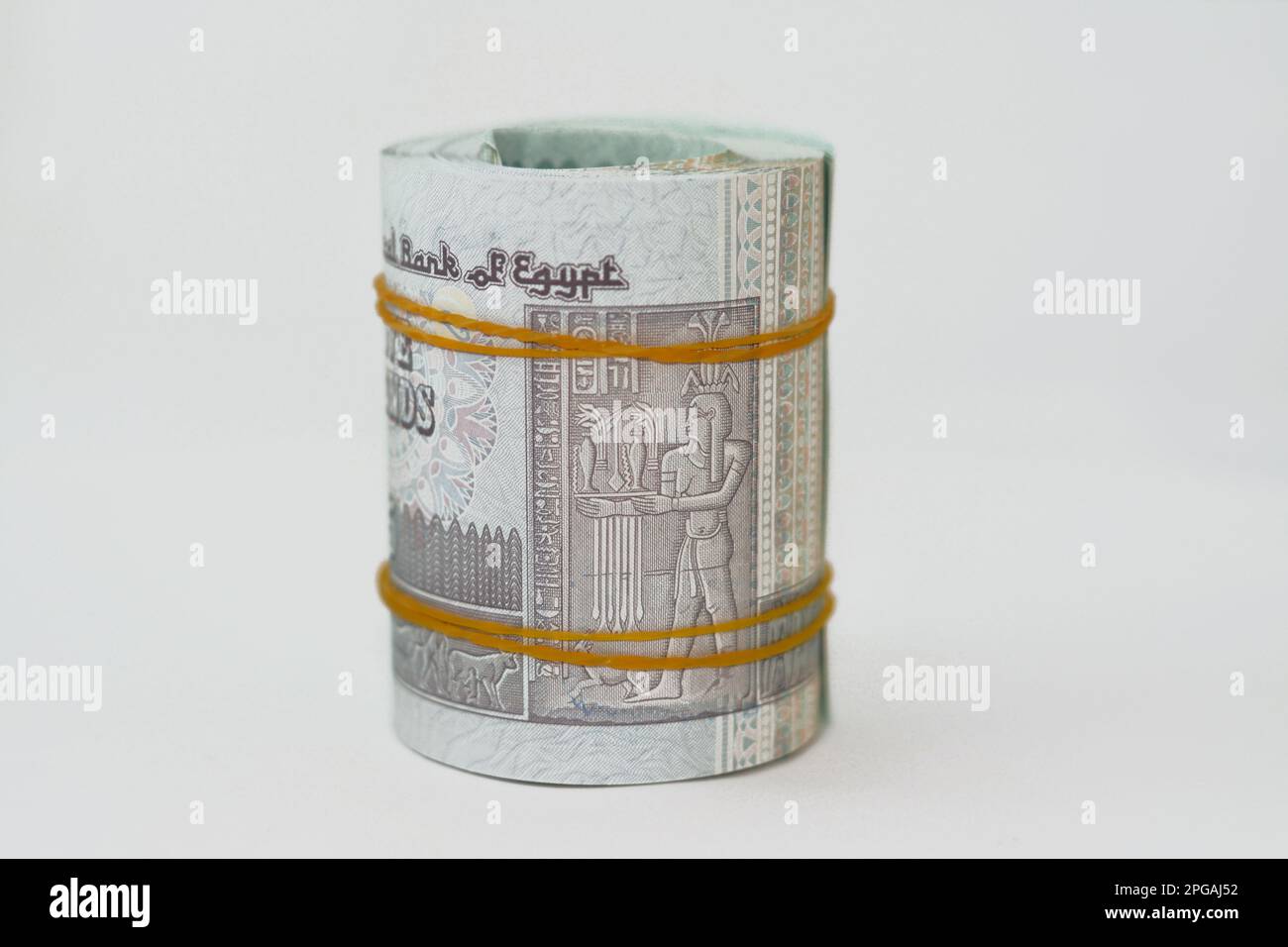 5 EGP LE five Egyptian pounds cash money bills rolled up with rubber ...