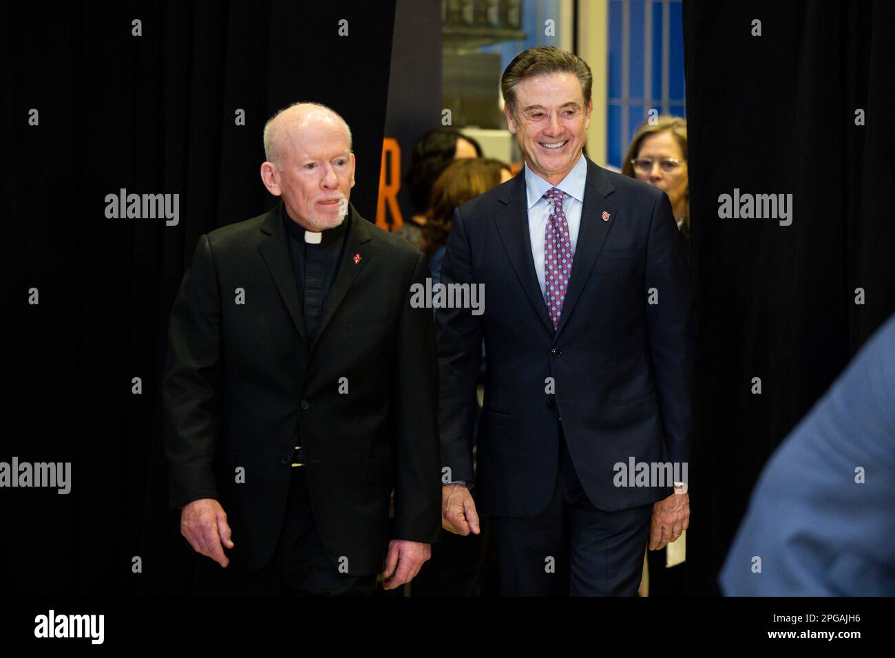 Rev. Brian J. Shanley, St. John's University President, left, walks ...