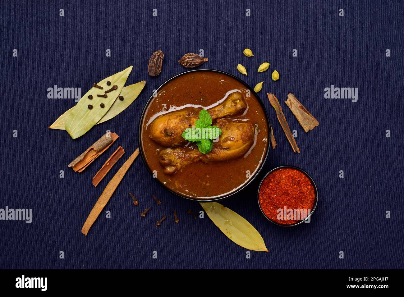 Top view of chicken curry with indian whole spices, chicken masala ...