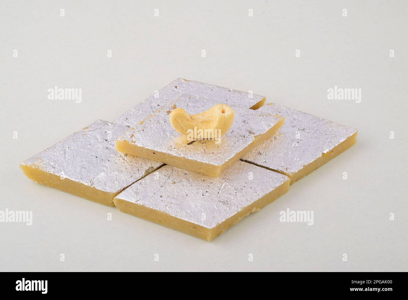 Closeup of kaju katli on white background Stock Photo - Alamy