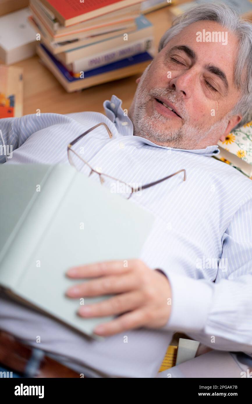 Man sleeping book on face hi-res stock photography and images - Alamy