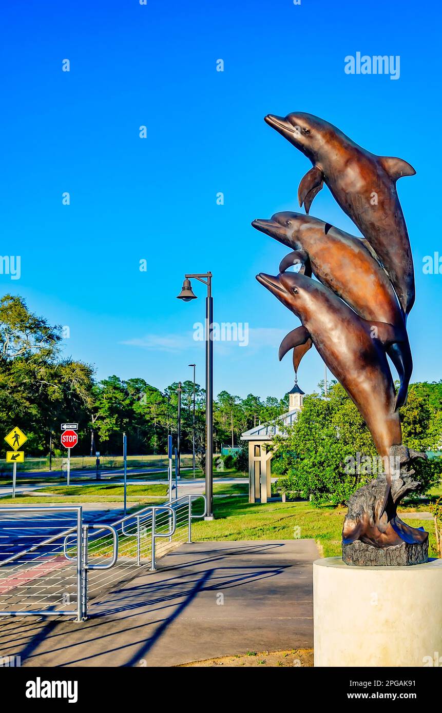 A dolphin sculpture stands in front of the Alabama Welcome Center ...