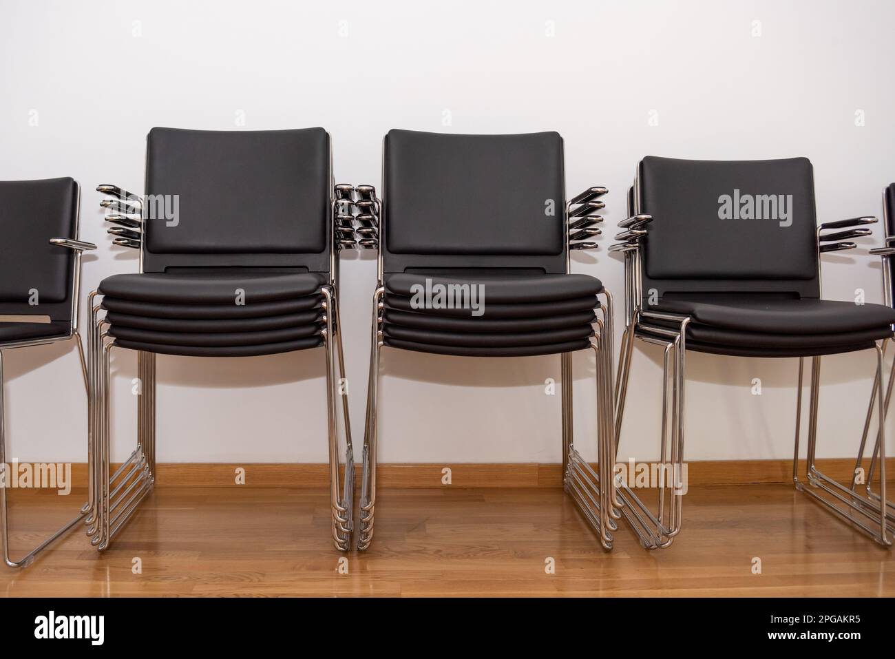 Stack office black chairs hi-res stock photography and images - Alamy