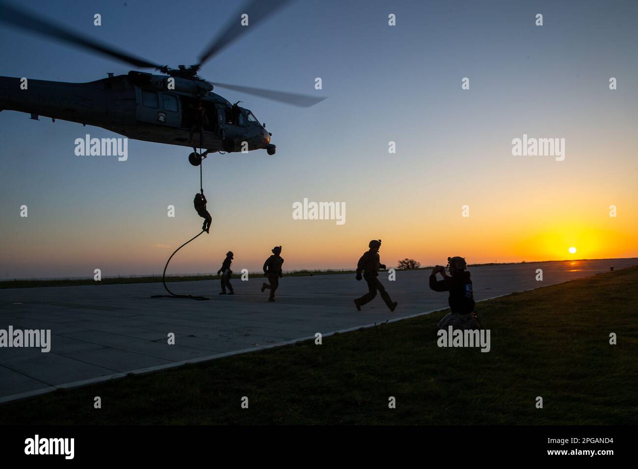 U.S. Marines in the ANGLICO Basic Course fast rope from an MH-60S ...