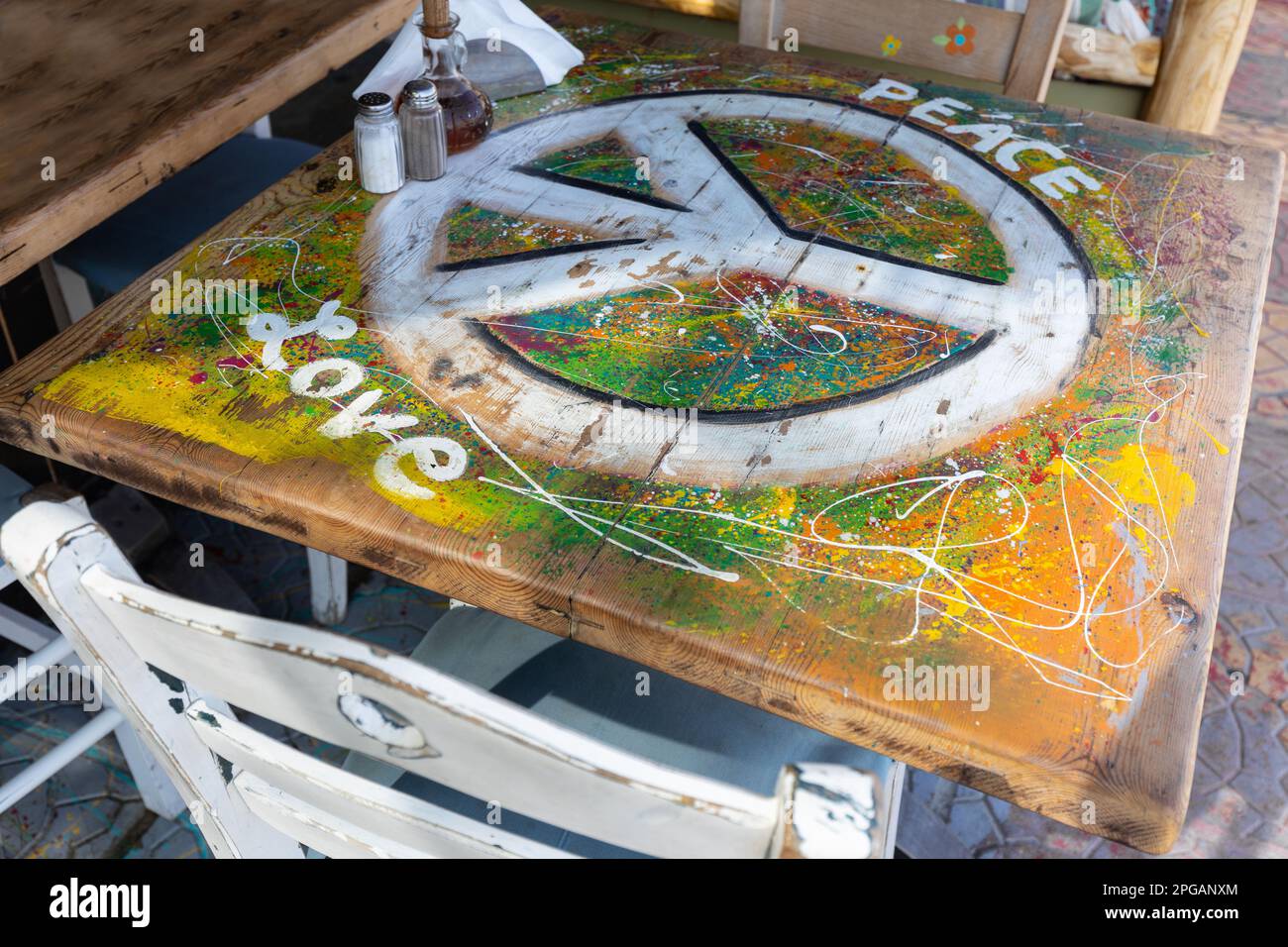 Original table in a cafe with inscriptions love and peace, Greece Stock ...