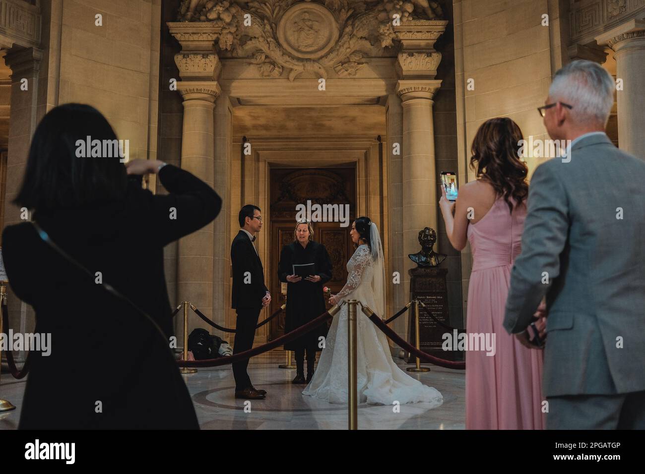 A couple standing is seen performing a wedding ritual in San Francisco ...