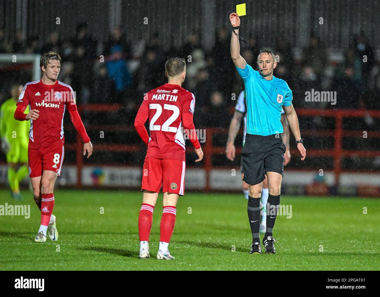 Dan Martin #22 of Accrington Stanley receives a yellow card during the ...