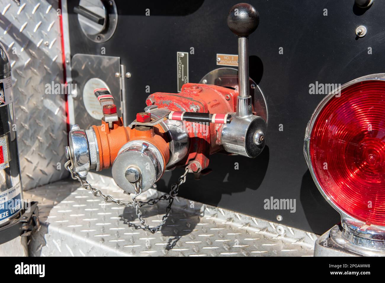Close up view of rear fire truck has large water control valves and ...