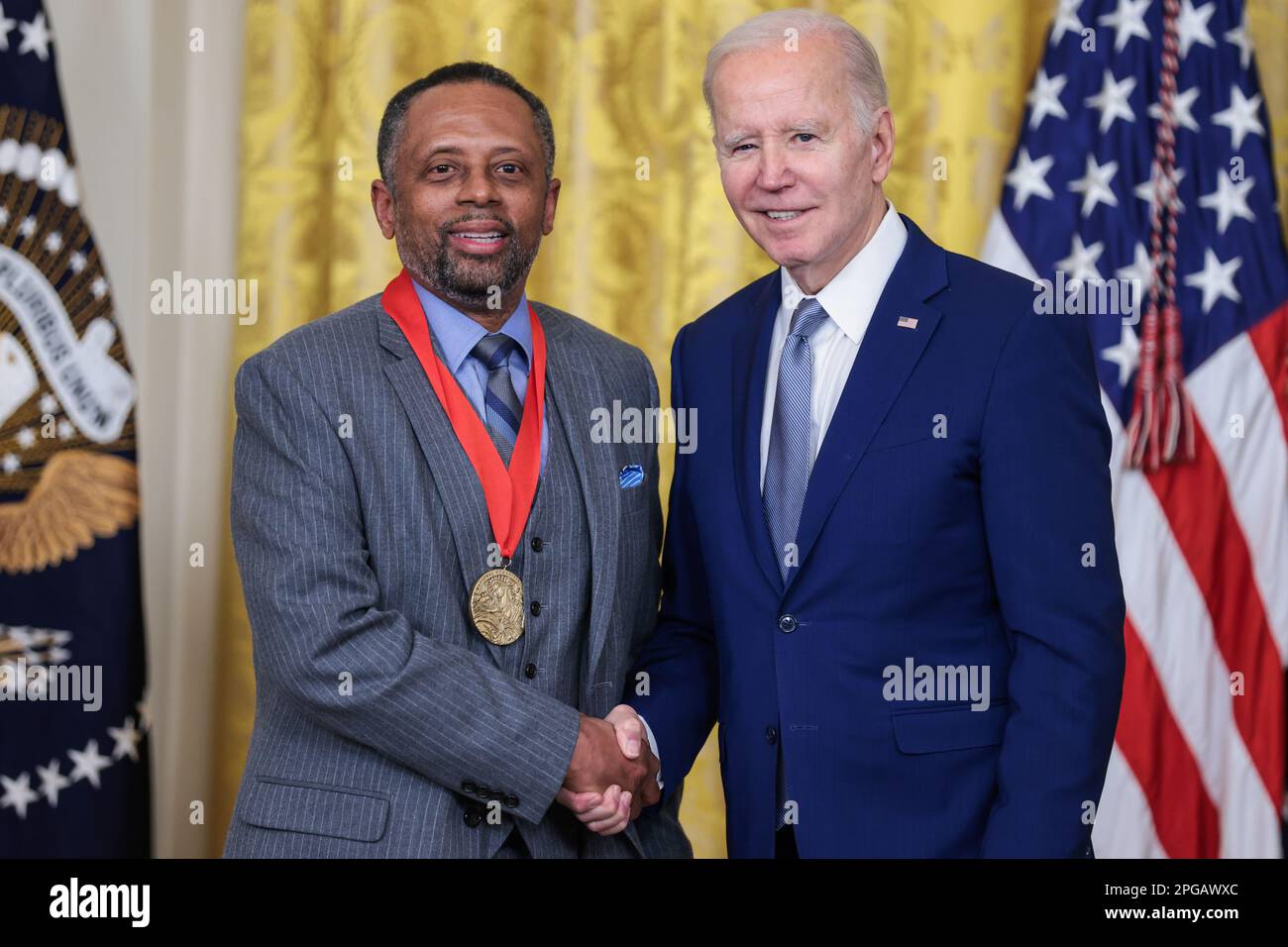Earl Lewis on stage with United States President Joe Biden during an ...