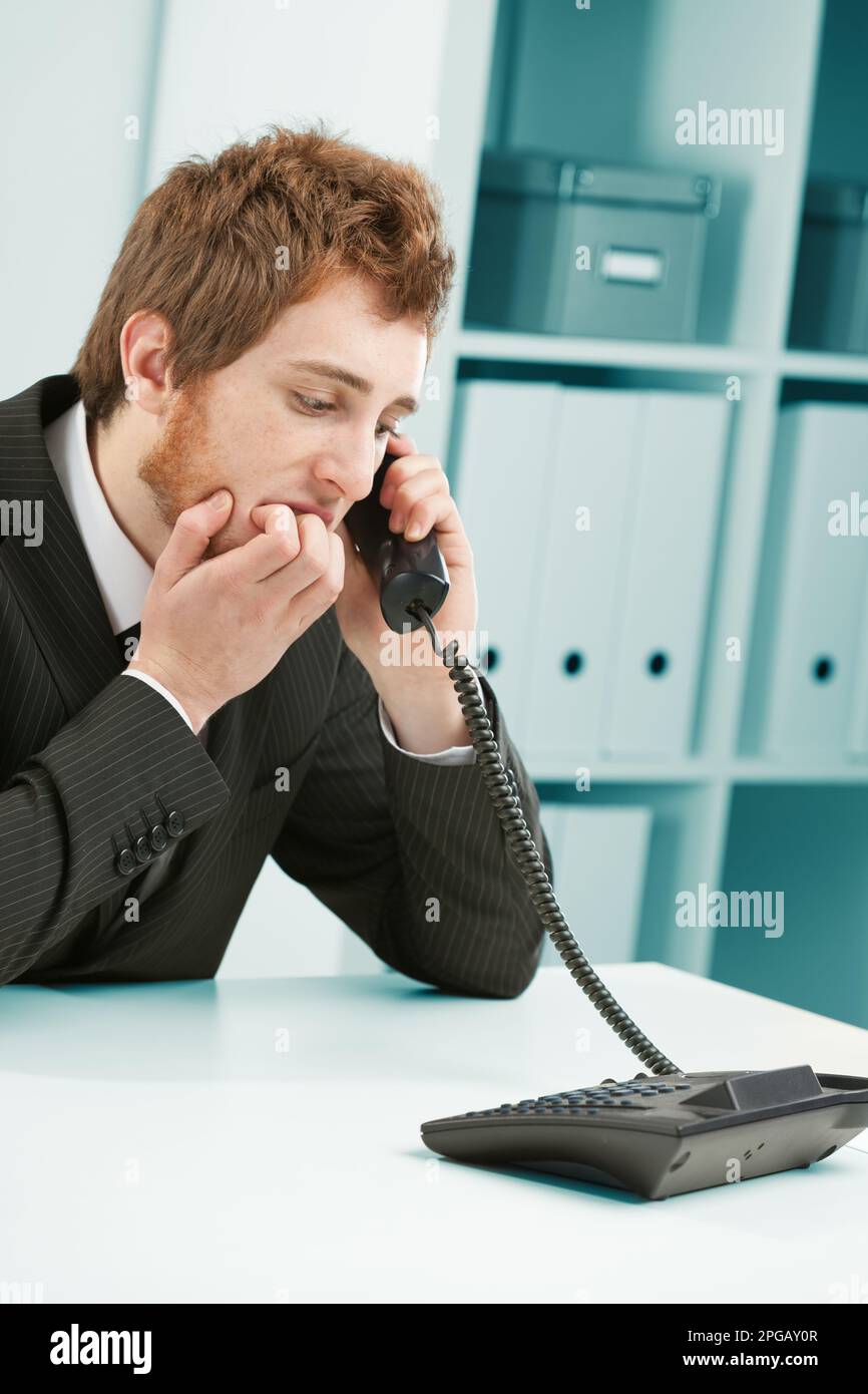 Fear, anxiety, communication stress? Worried-looking young employee ...