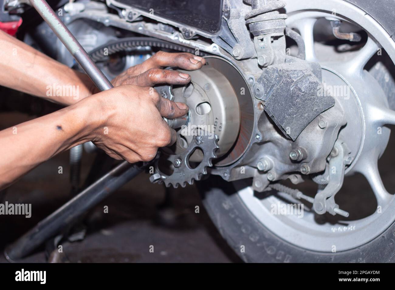 Motorcycle mechanic check the condition of Auto Transmission system or ...