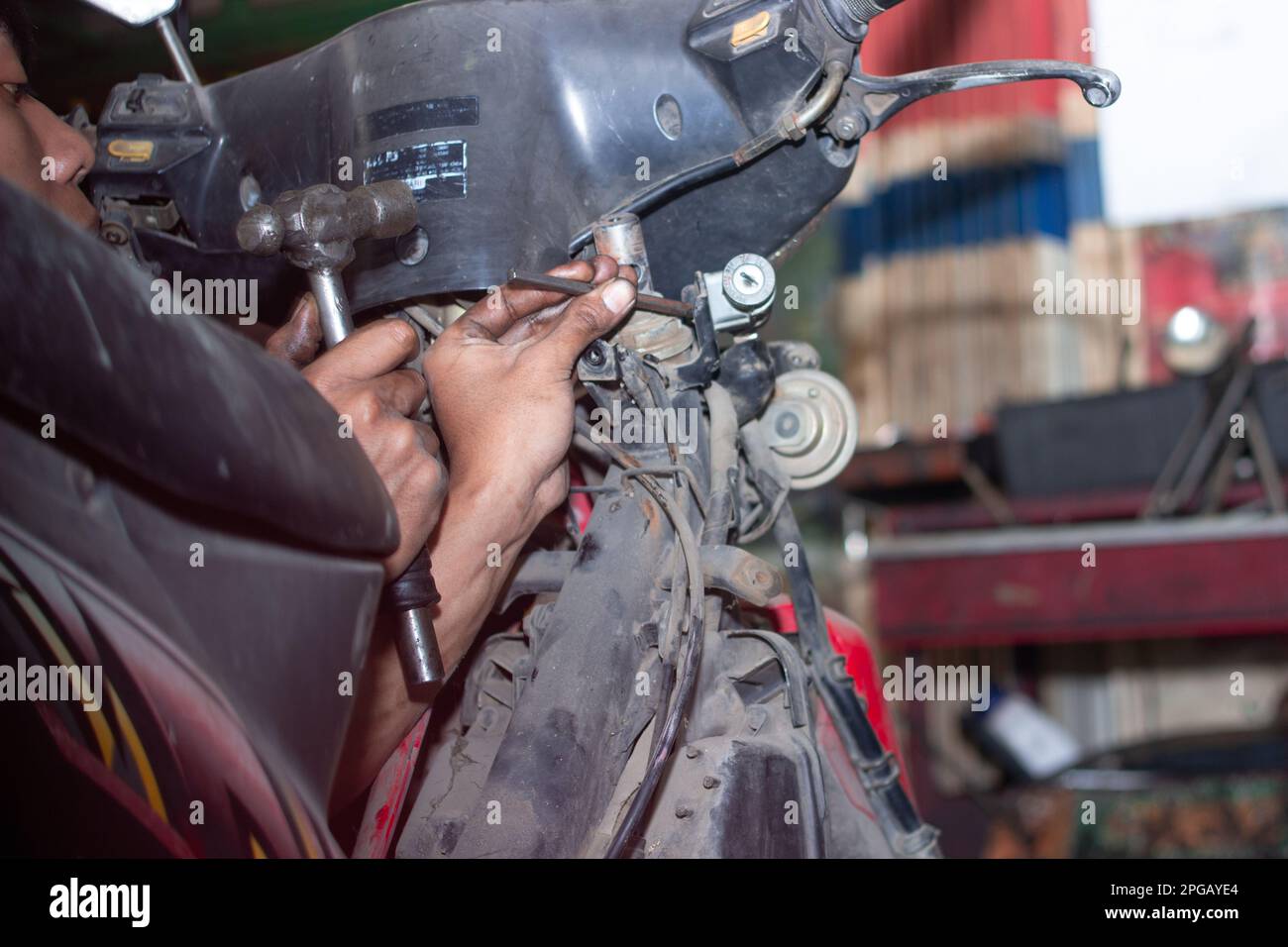 Motorcycle mechanic check the condition of Auto Transmission system or Clutch system of scooter ...