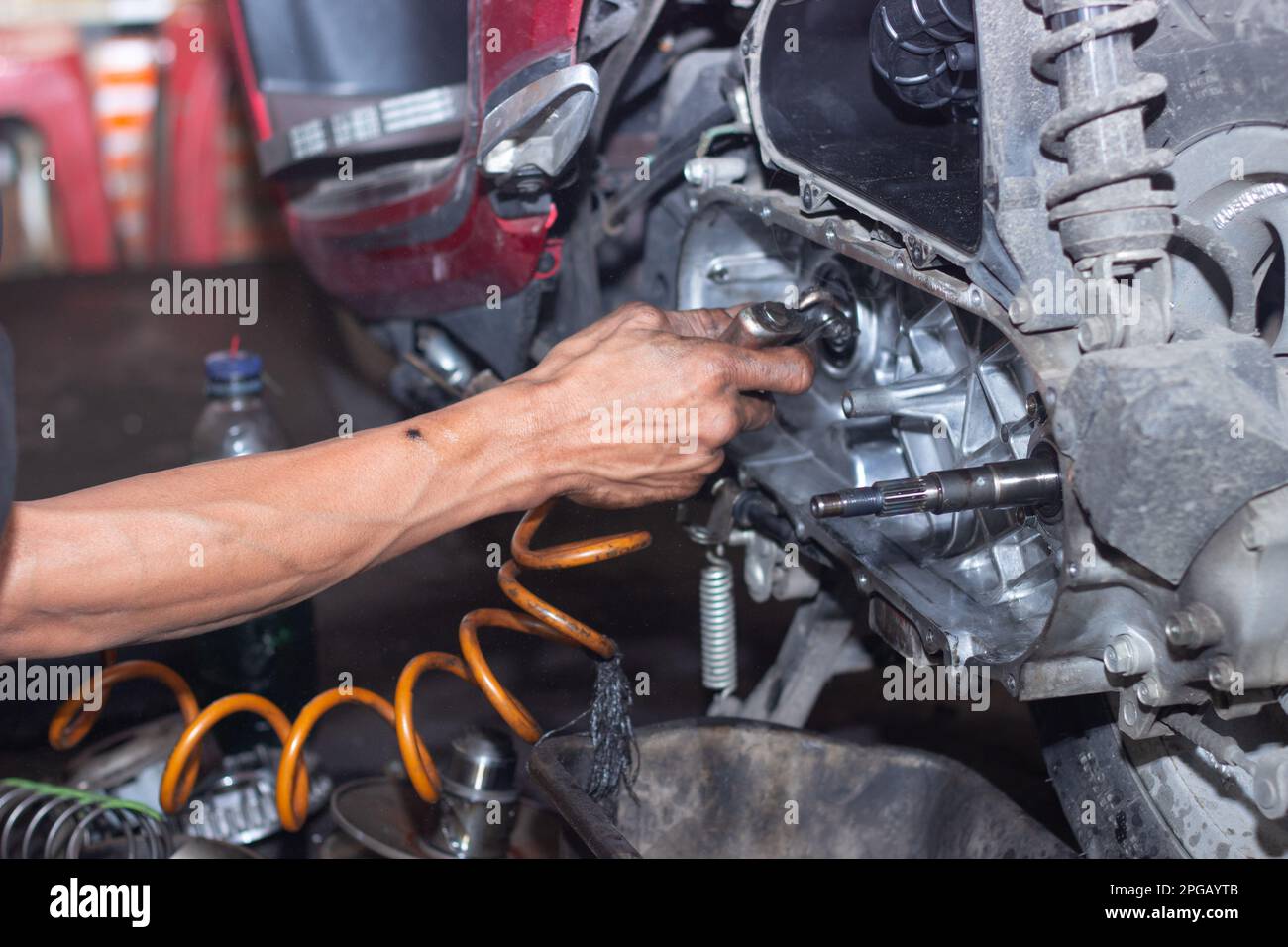 Motorcycle mechanic check the condition of Auto Transmission system or ...