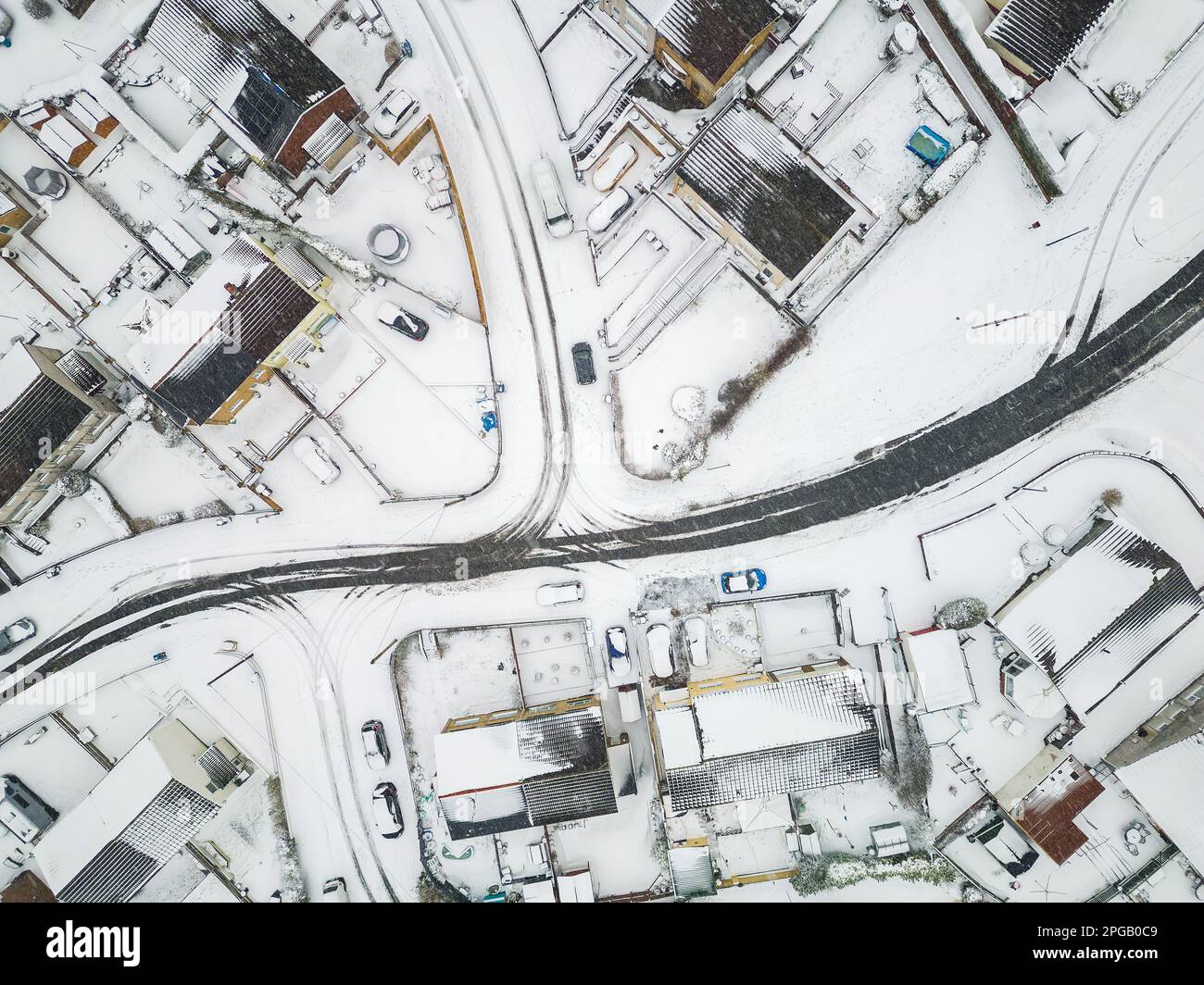 Aerial view of snow covered streets and roads during a blizzard (Wales ...